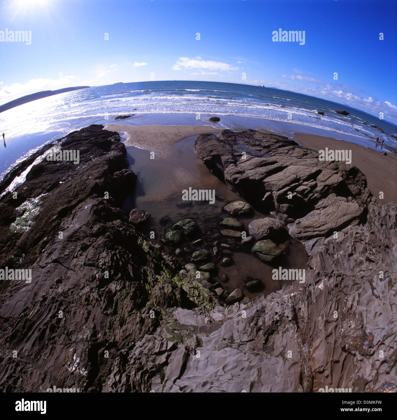 a coastal landscape with a rock pool Stock Photo - Alamy