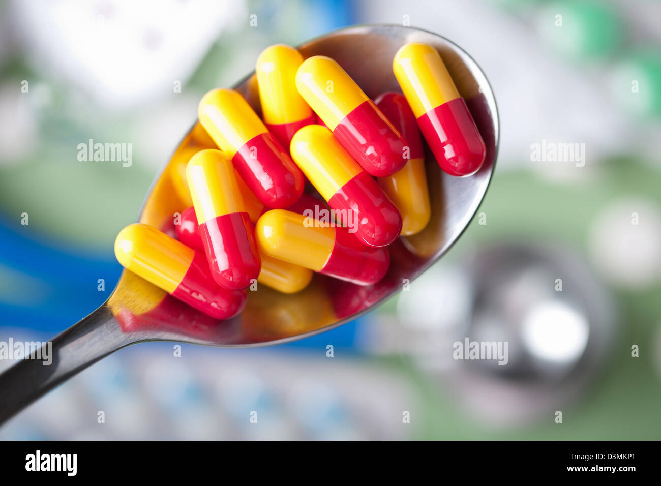 capsule pills in spoon Stock Photo - Alamy