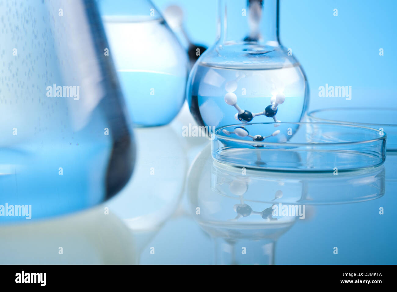 Molecular model and flasks in laboratory Stock Photo - Alamy