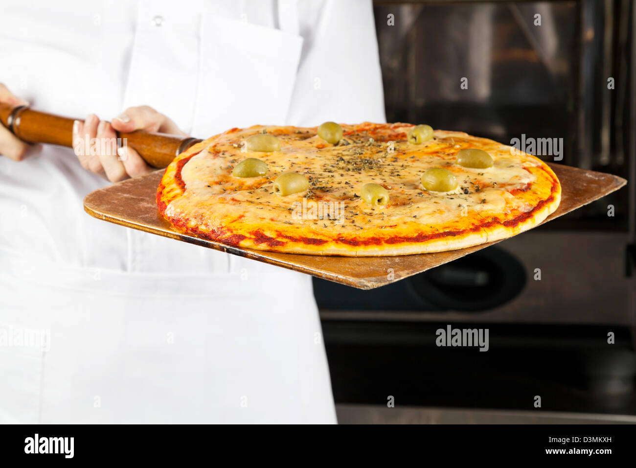 Mature chef holding pizza hi-res stock photography and images - Alamy