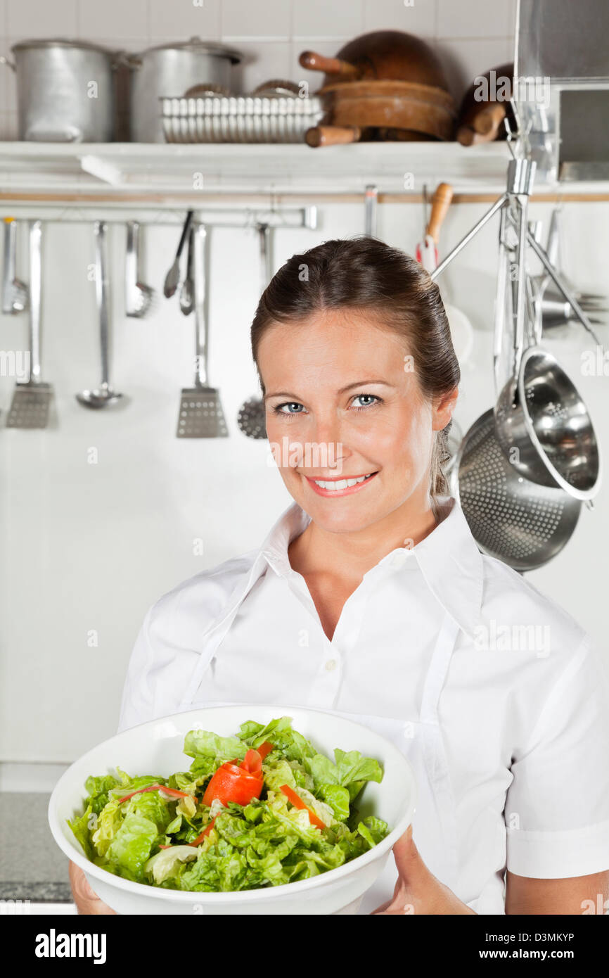Female Chef Holding Bowl Of Salad Stock Photo - Alamy
