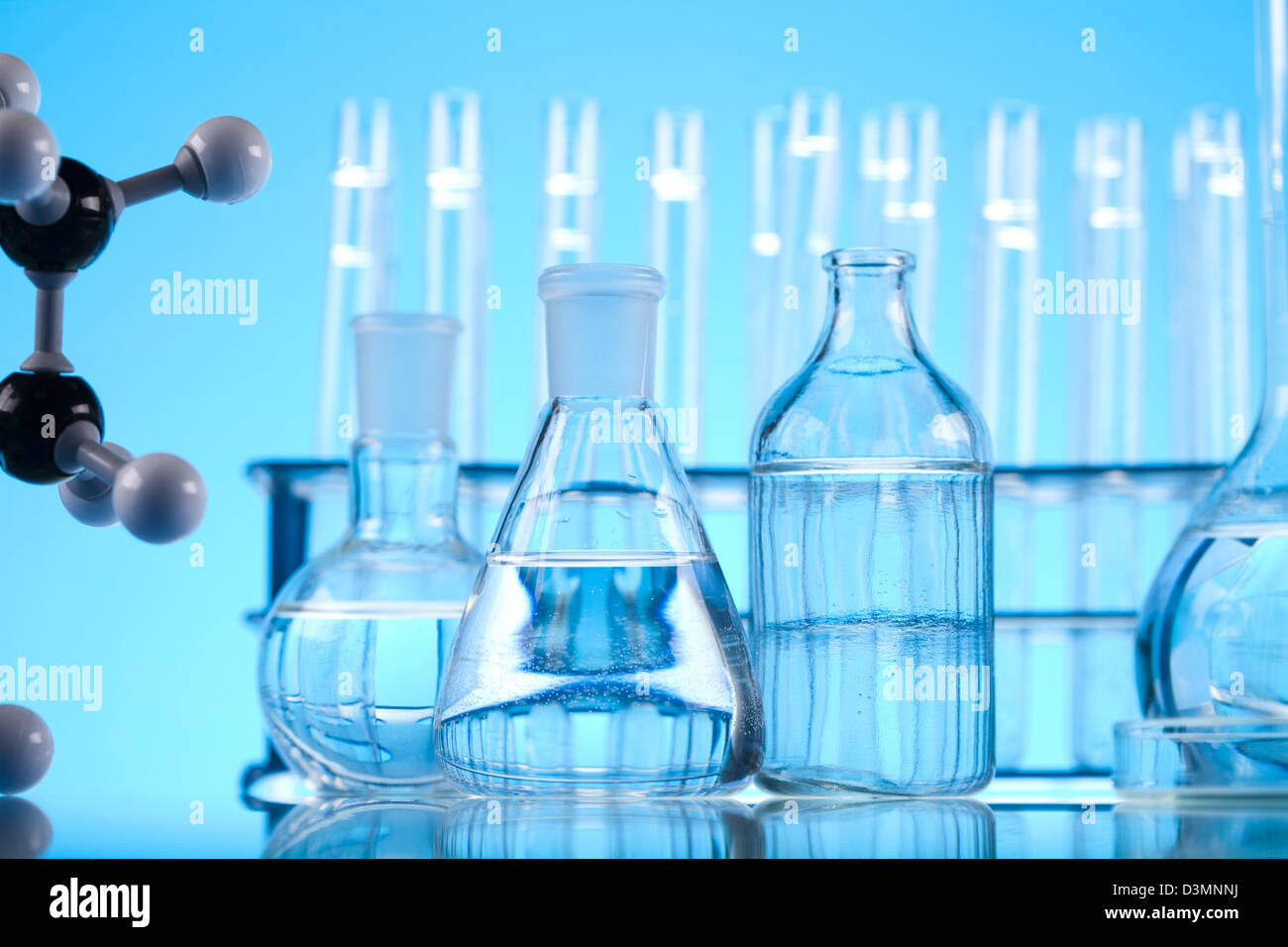 Molecular model and flasks in laboratory Stock Photo - Alamy