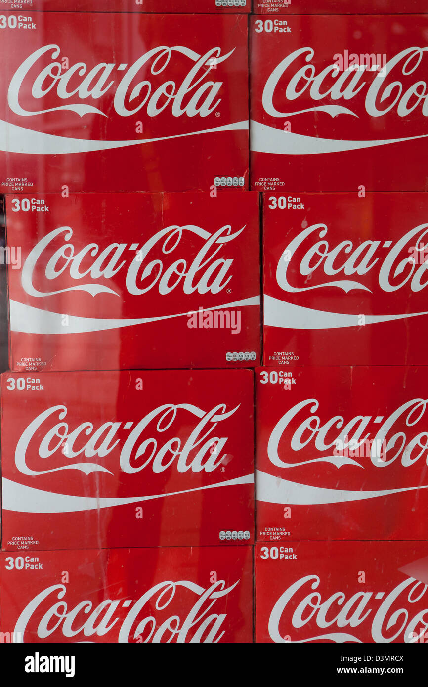 Packs of Coca-Cola in shop window Stock Photo - Alamy