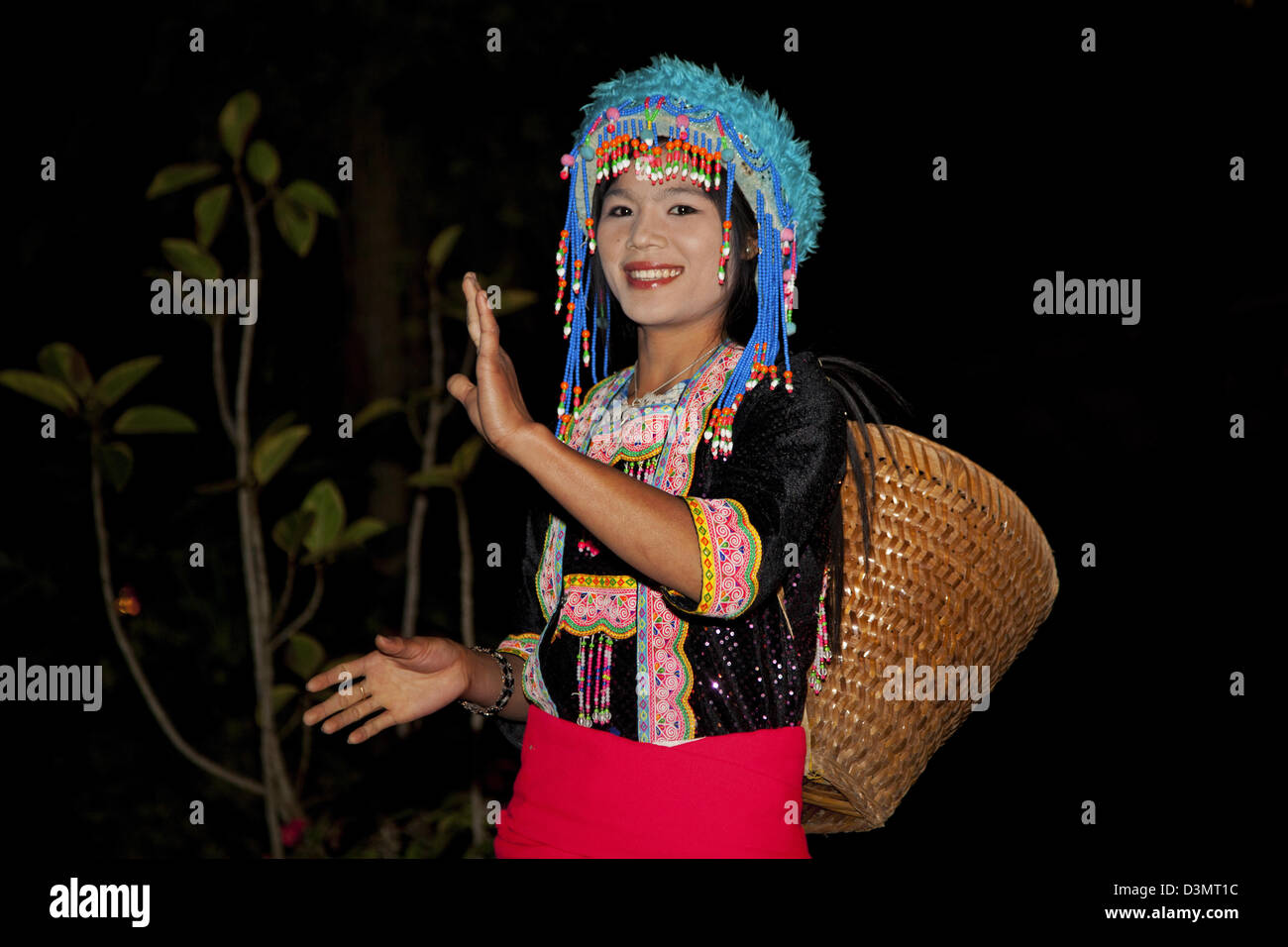Portrait of traditional tribal dancer wearing headdress with colourful ...