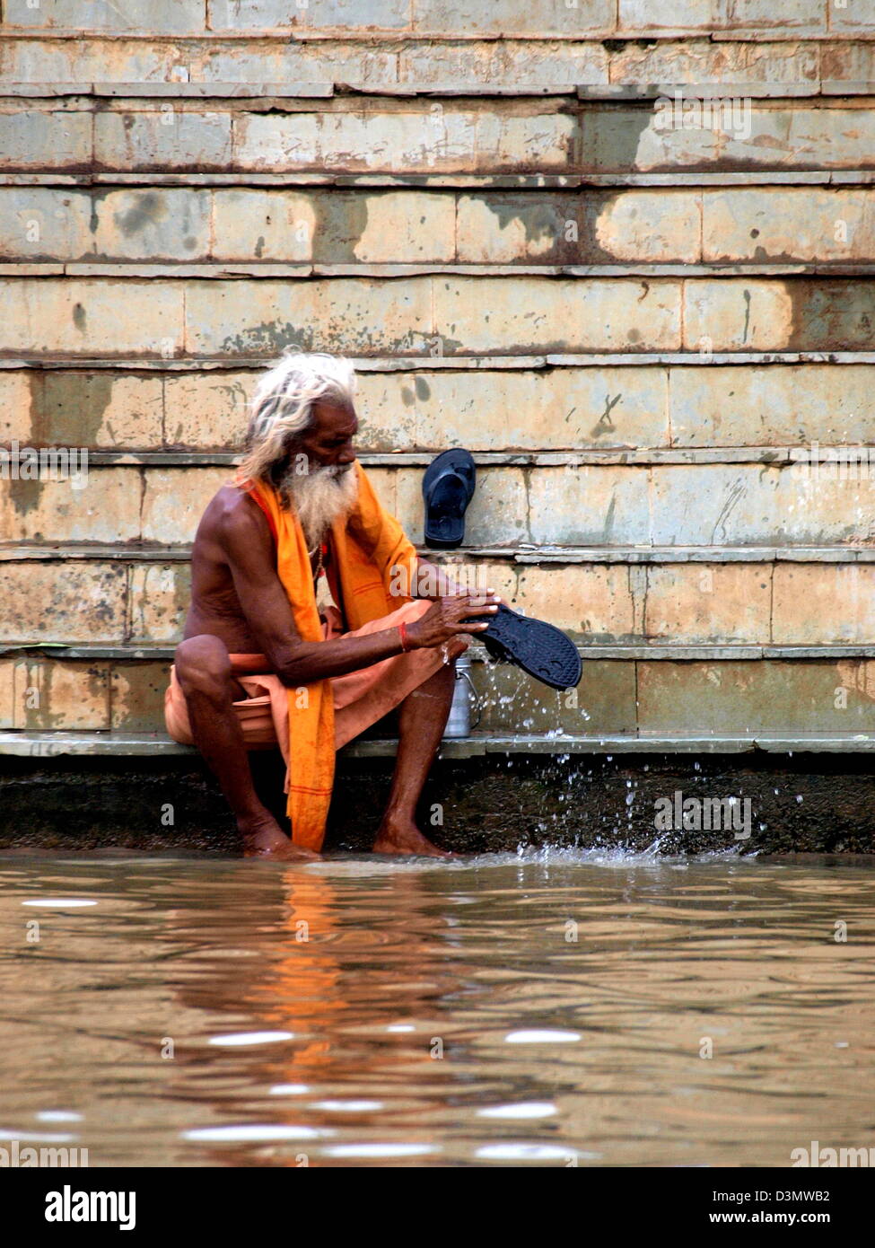 Morning Hindu Indian bathers along the ghats that line the Mandakini ...
