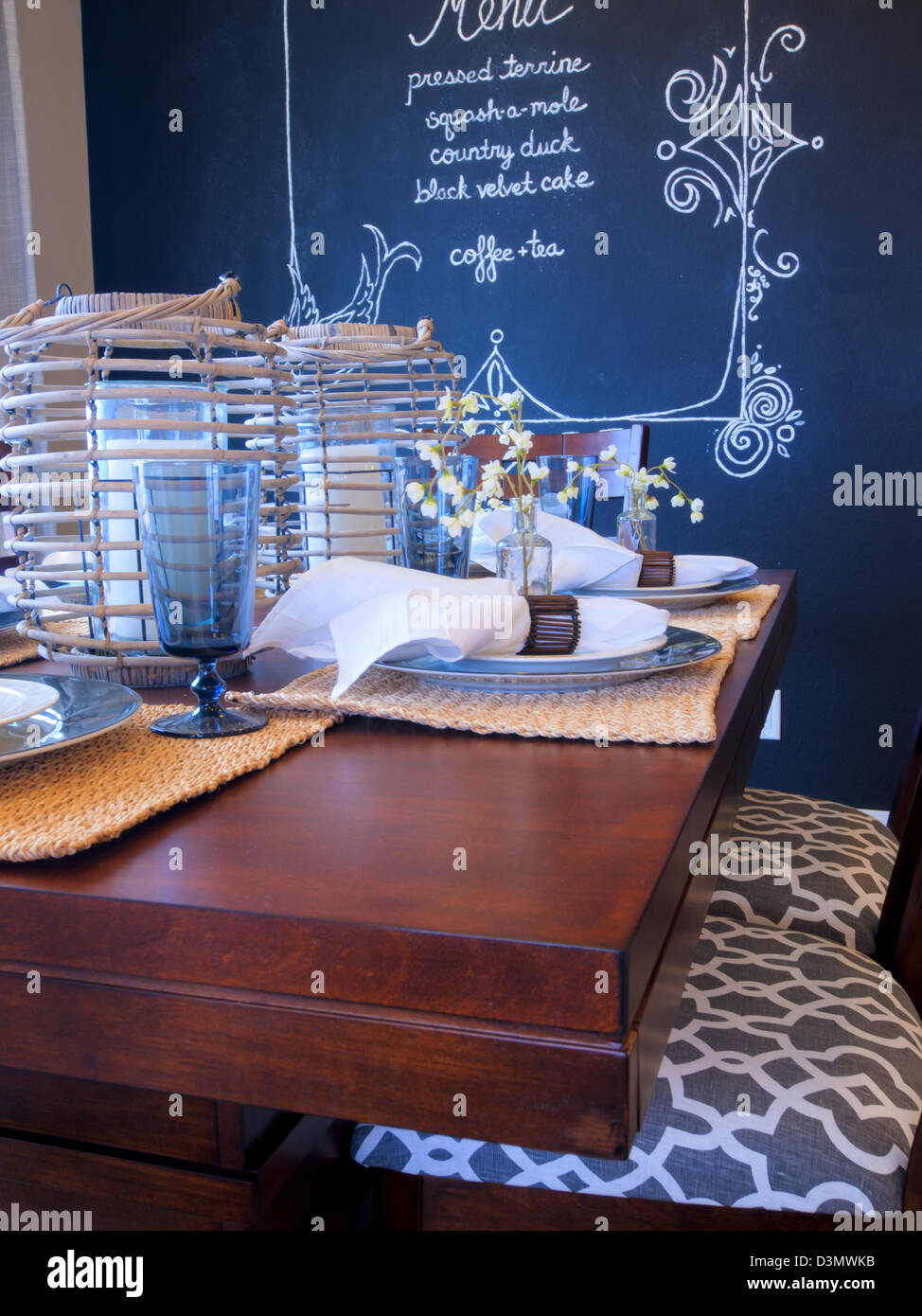 Modern dining room with table set for family dinner Stock Photo - Alamy