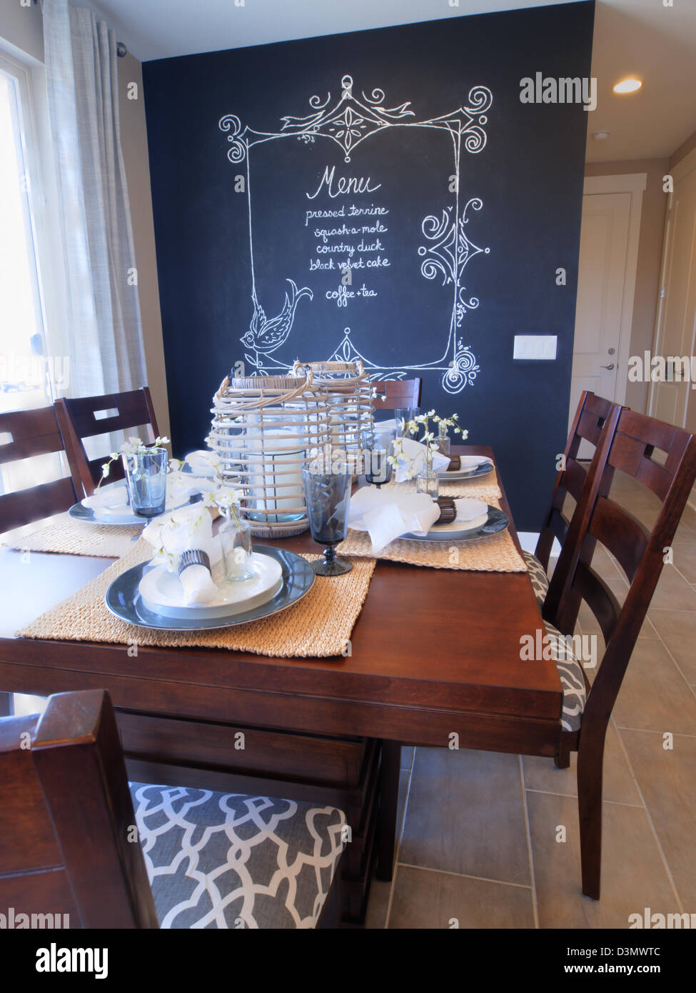 Modern dining room with table set for family dinner Stock Photo - Alamy