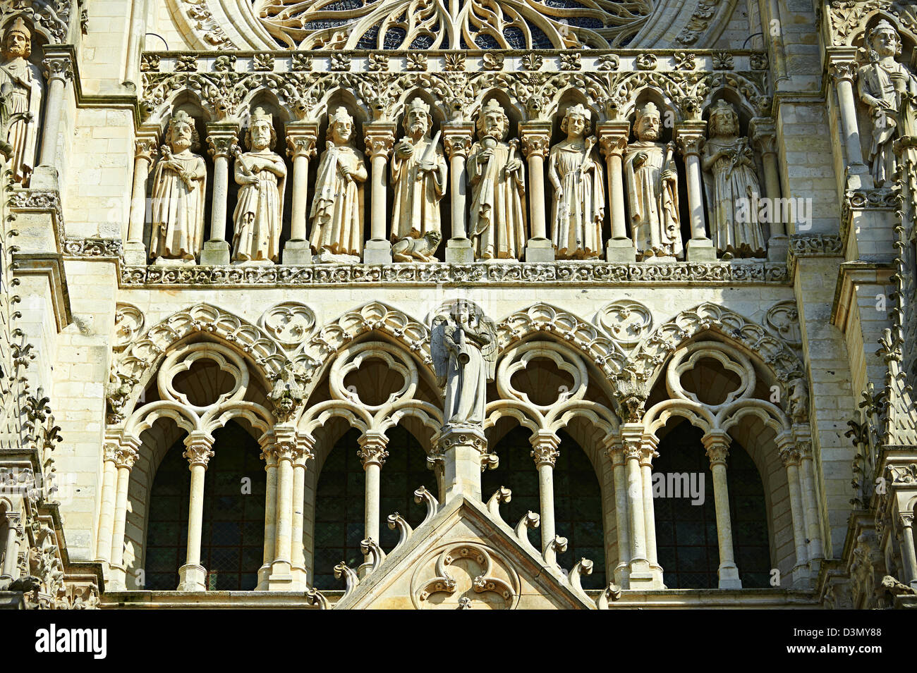 Gothic statues and the facade of the Gothic Cathedral of Notre-Dame ...