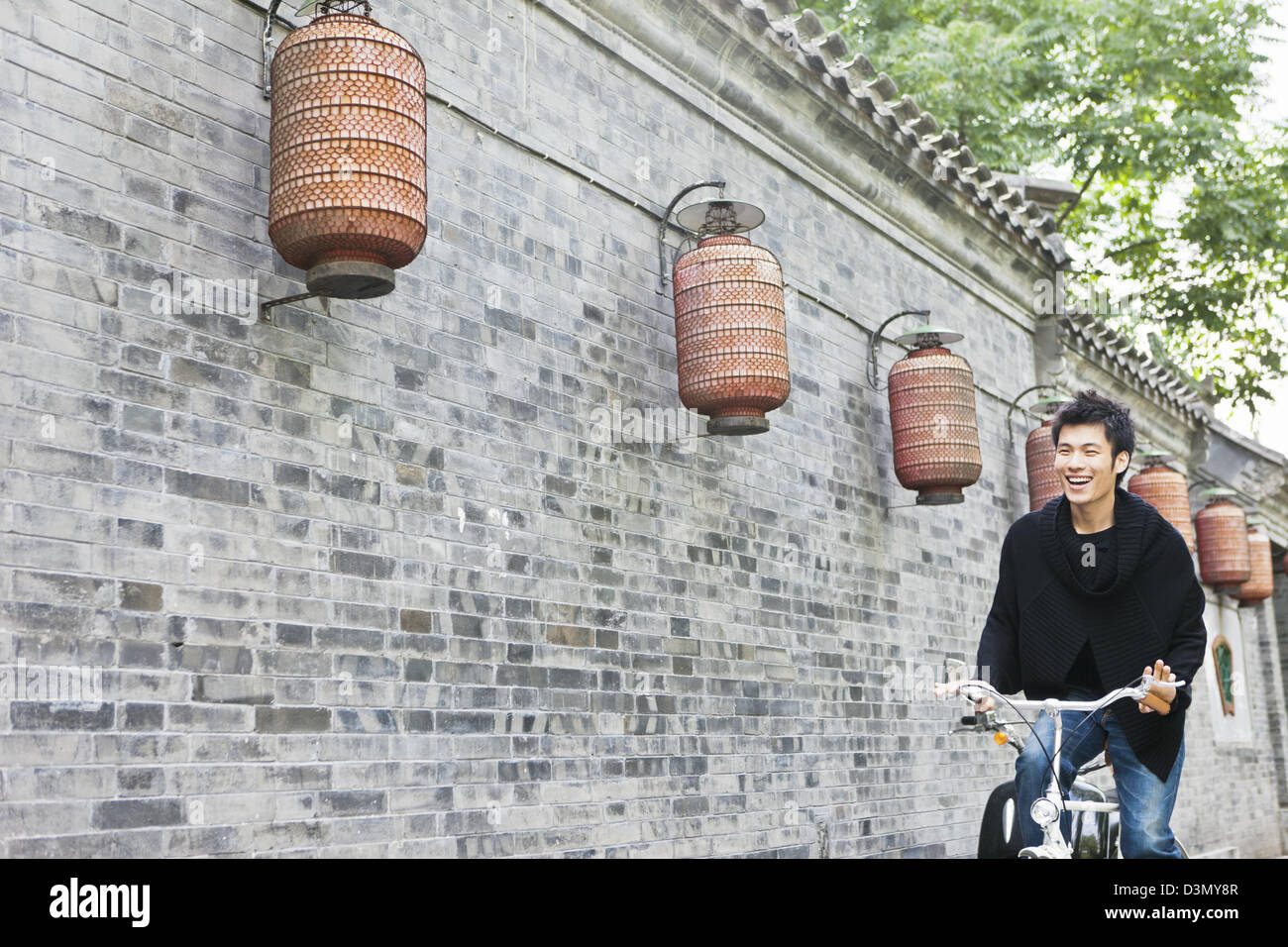 Chinese man riding his bicycle hi-res stock photography and images - Alamy