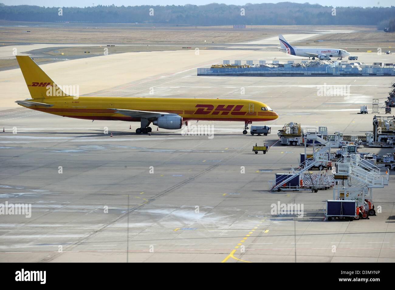 An aircraft of DHL parcel services stands on the airfield of of the ...