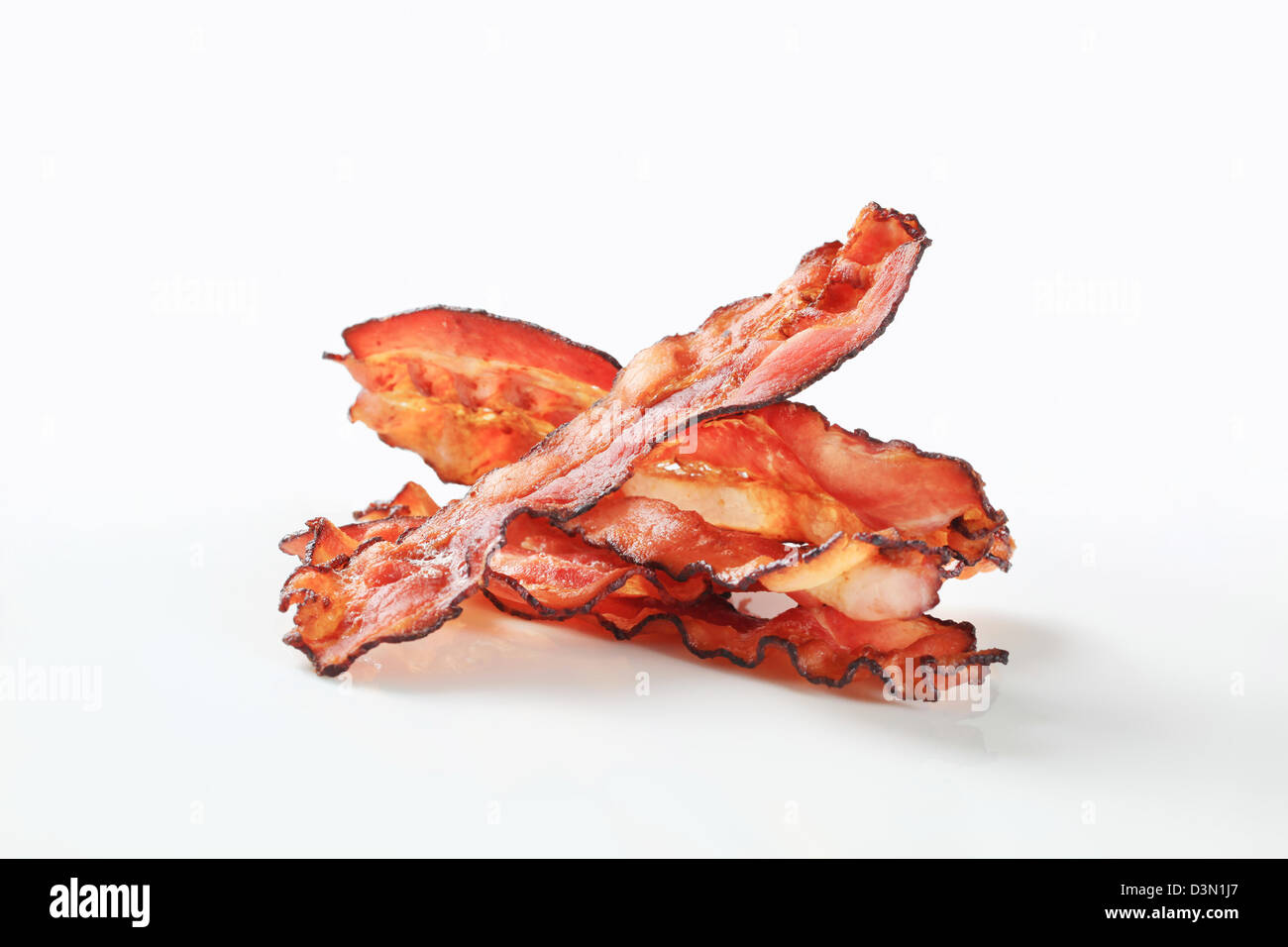 Crispy pan-fried strips of bacon Stock Photo - Alamy