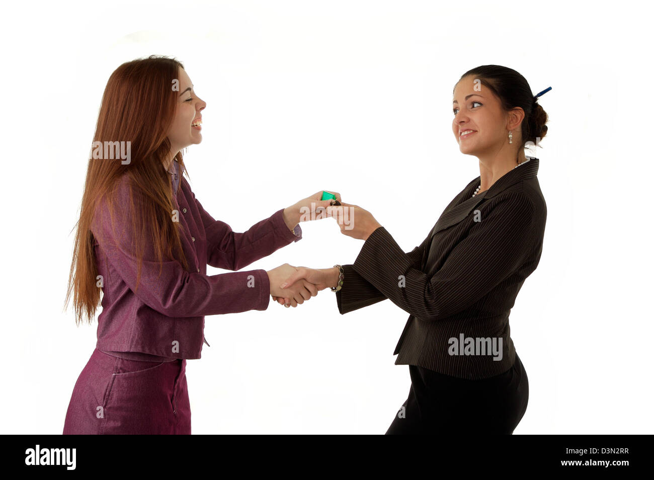 woman handing over house key to another woman Stock Photo - Alamy