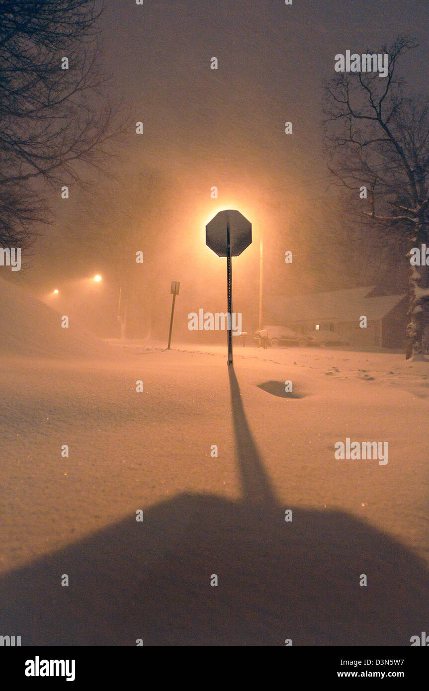 Light hits a stop sign in a rural neighborhood during the massive ...