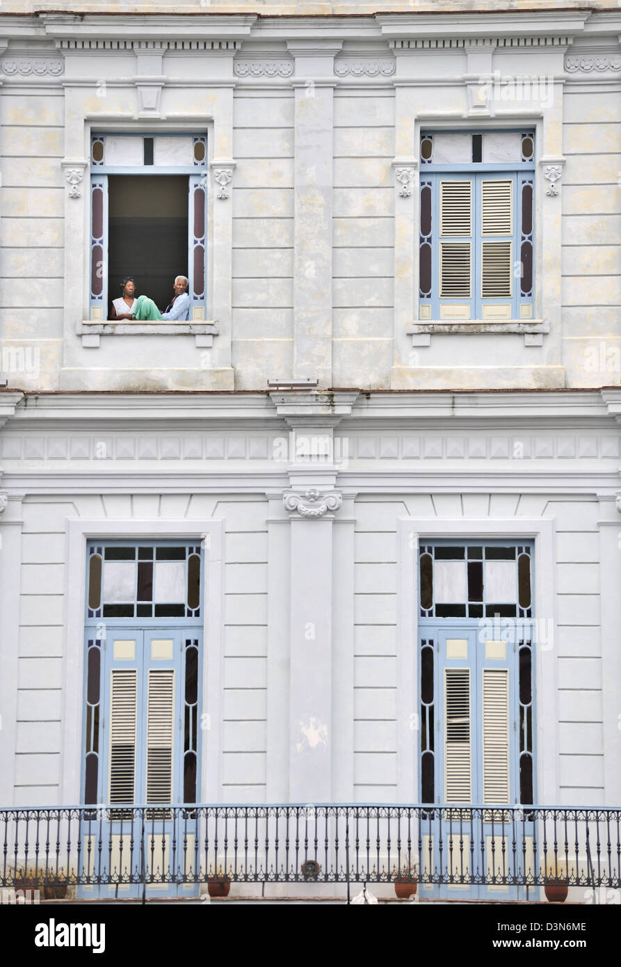 Two people in a window, Havana, Cuba Stock Photo - Alamy