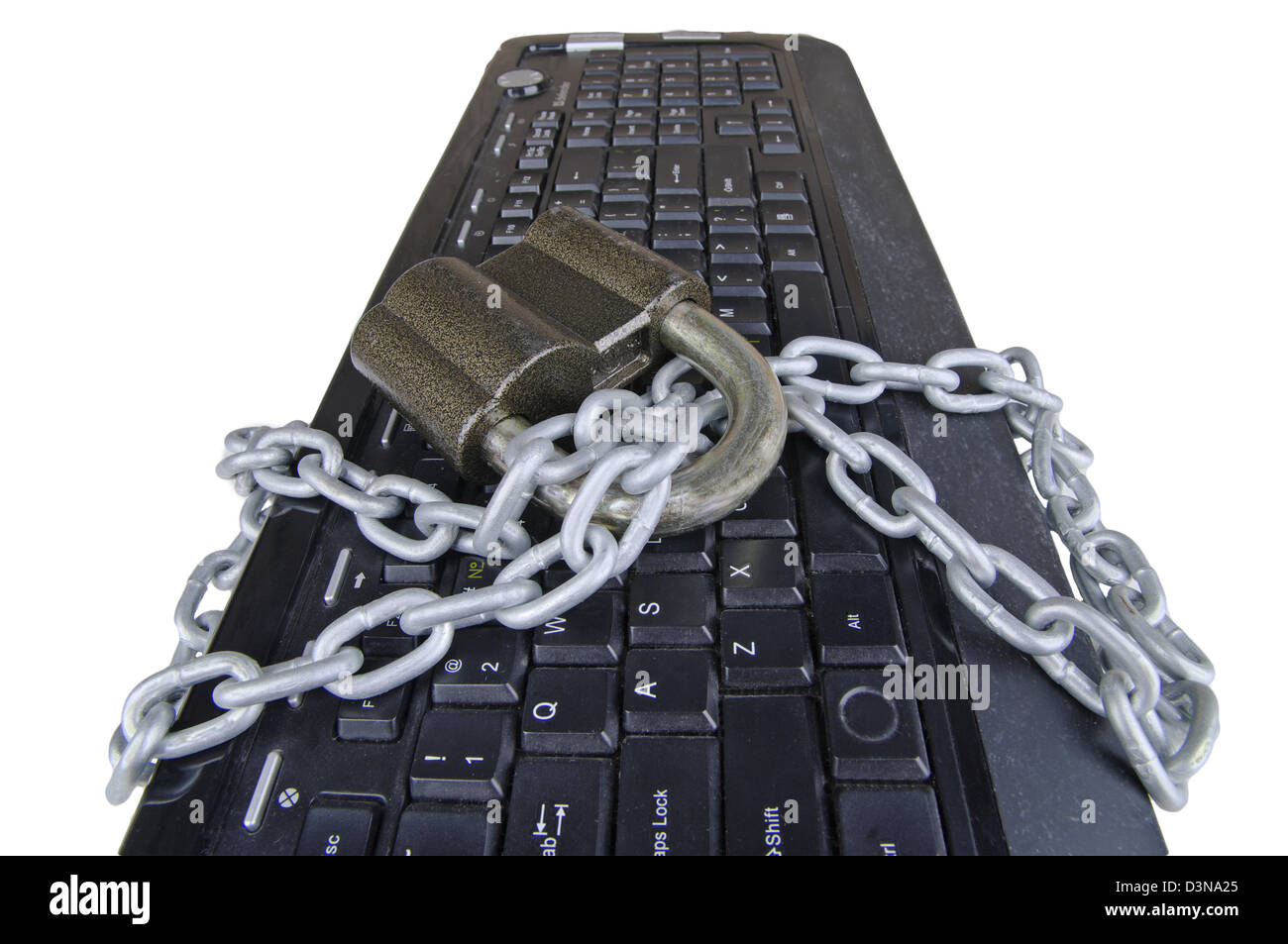 computer keyboard secured with chain and padlock on the white ...