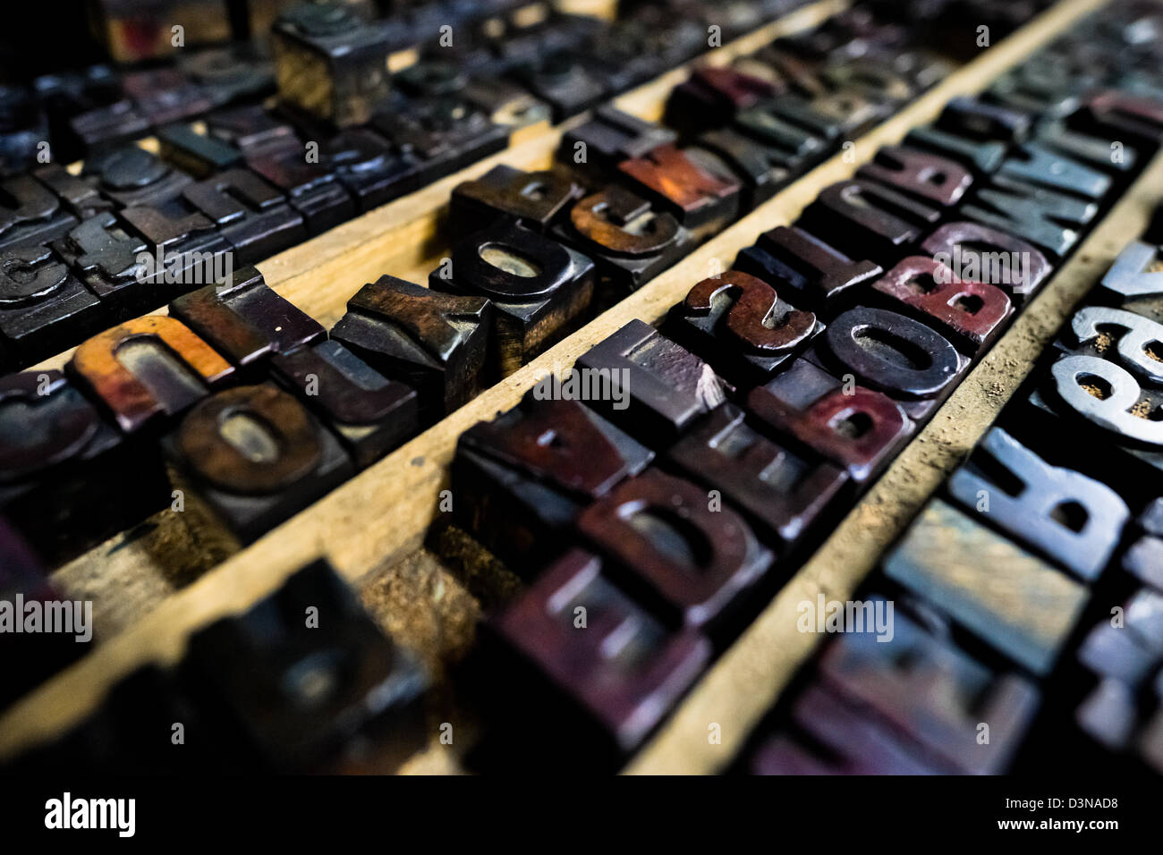 Letterpress types, made of wood, placed in a tray in the vintage print ...