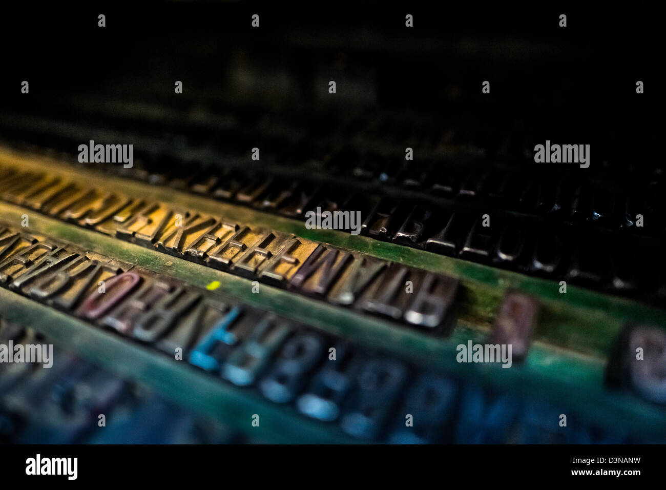 Letterpress types, made of wood, placed in a tray in the vintage print ...