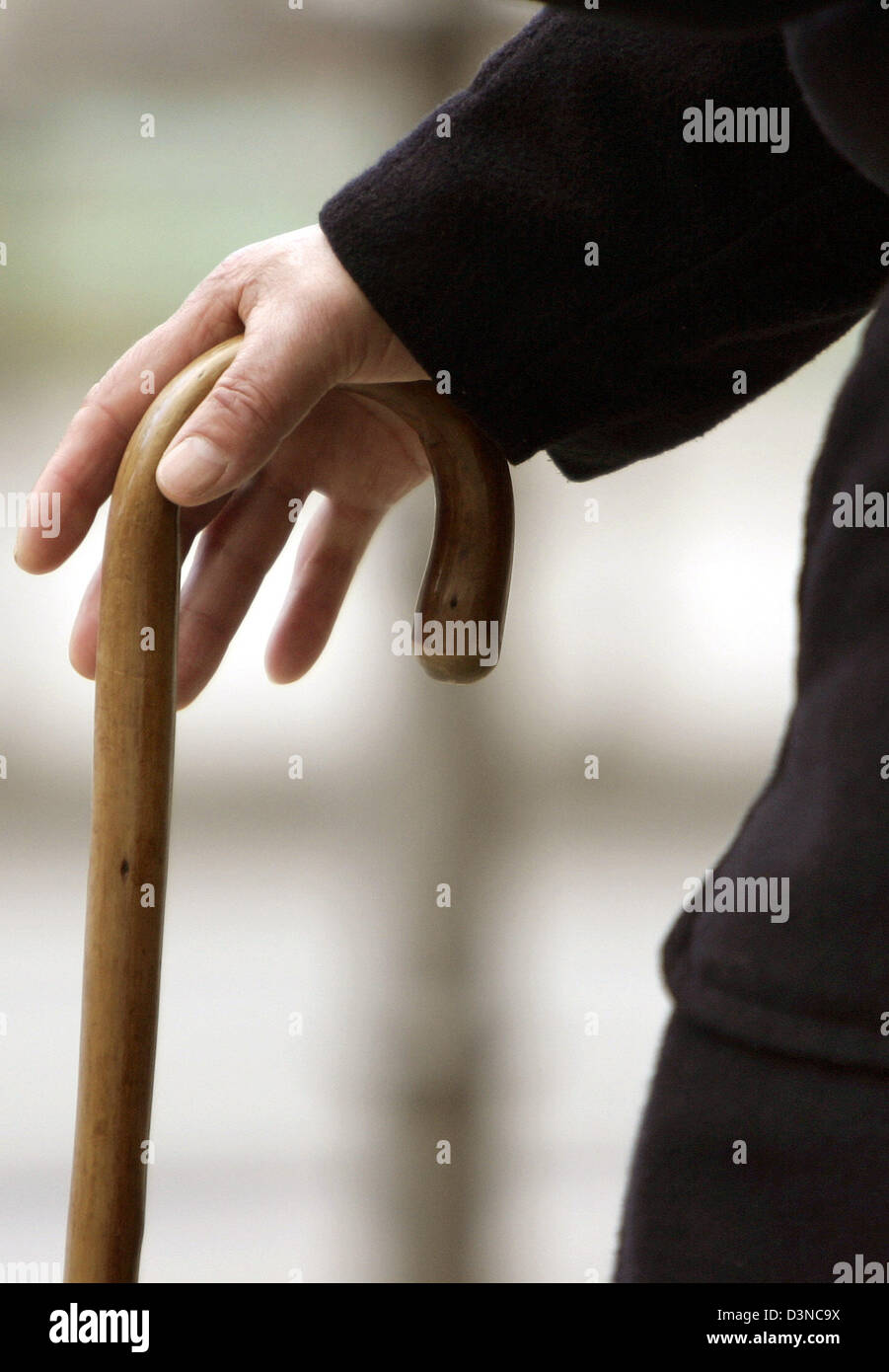 An old woman leans on a cane in Frankfurt, Germany, 10 March 2006 ...