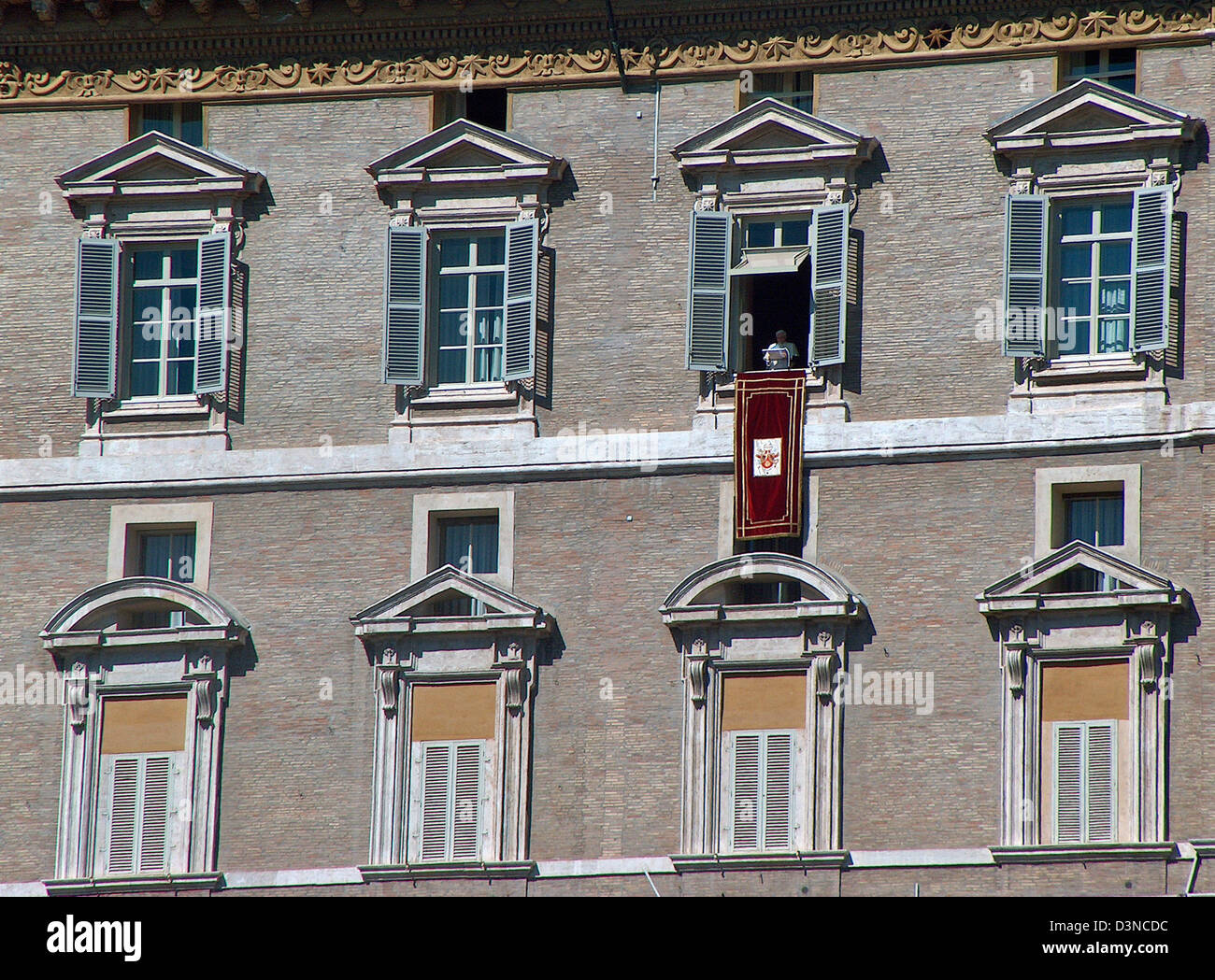 Pope Benedict XVI speaks the Angelus prayer from the window of his ...