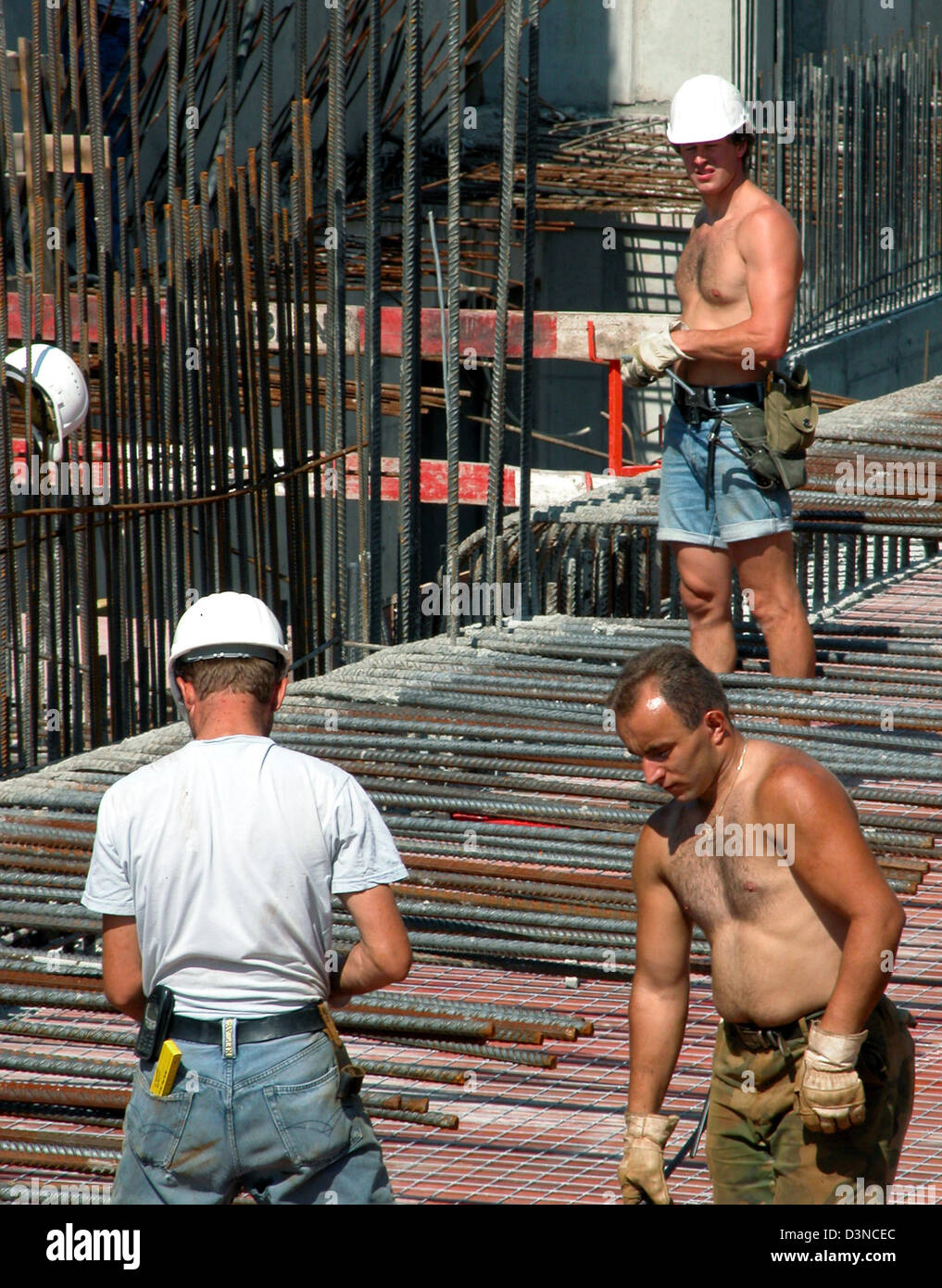 (FILES) Construction workers work at a construction site in Stuttgart ...