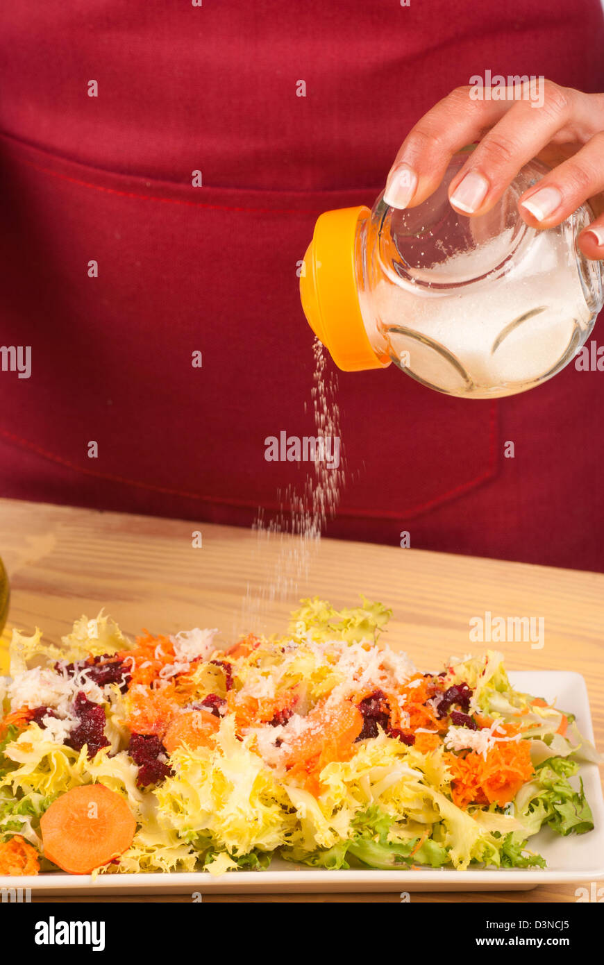 Adding salt to a meal hi-res stock photography and images - Alamy
