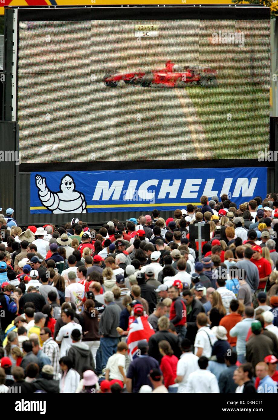 Spectators watch on the giant screen the German Formula One driver ...
