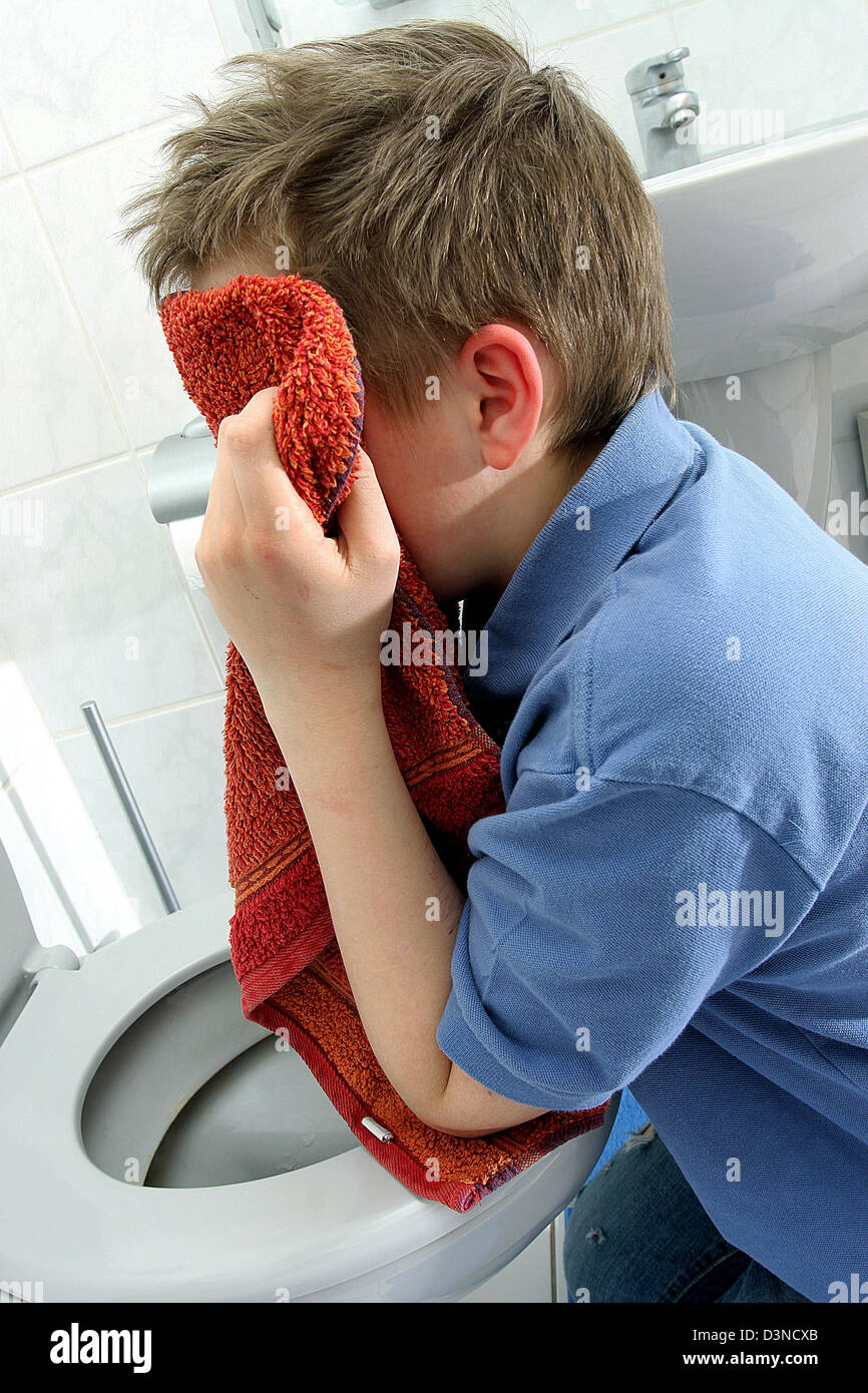 A teenager cleans his face after vomitting into a flush lavatory in ...
