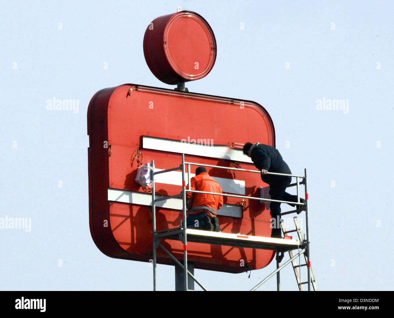 Workers mount a new ribbon to the logo of Berman bank Sparkasse in ...