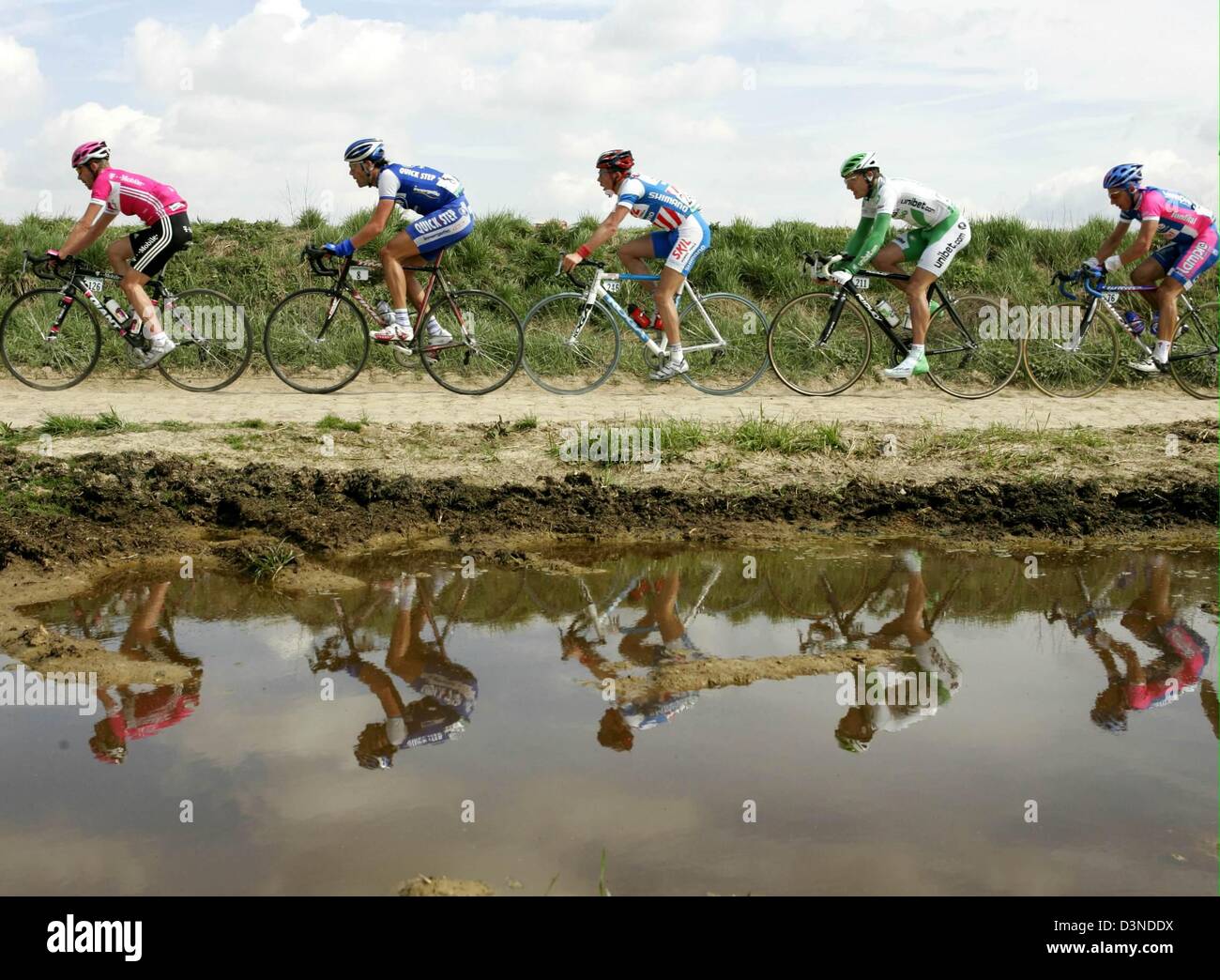 The peloton races over one of the notorious cobblestone parts during ...