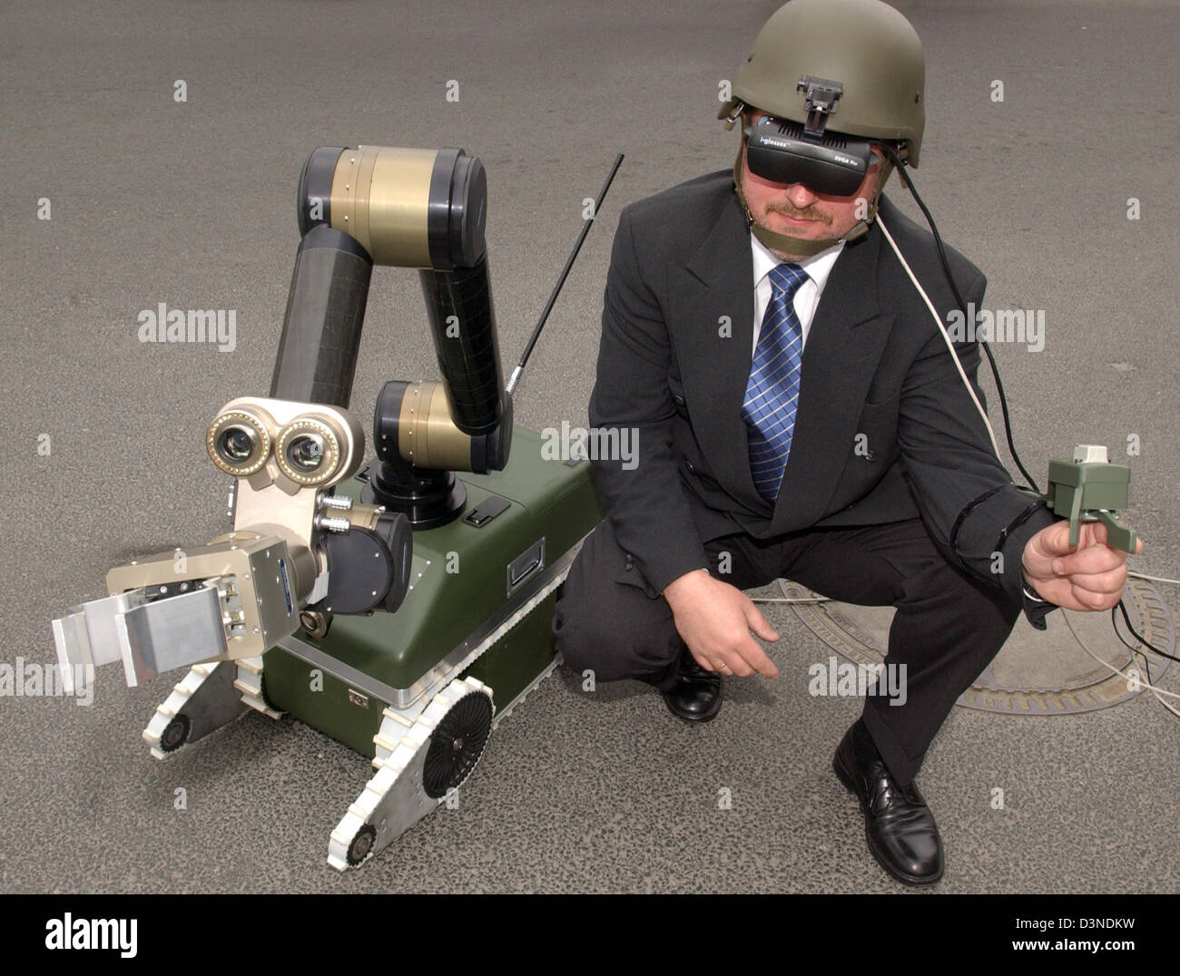 An employee of robotics manufacturer 'Robowatch und Diehl BGT Defense ...