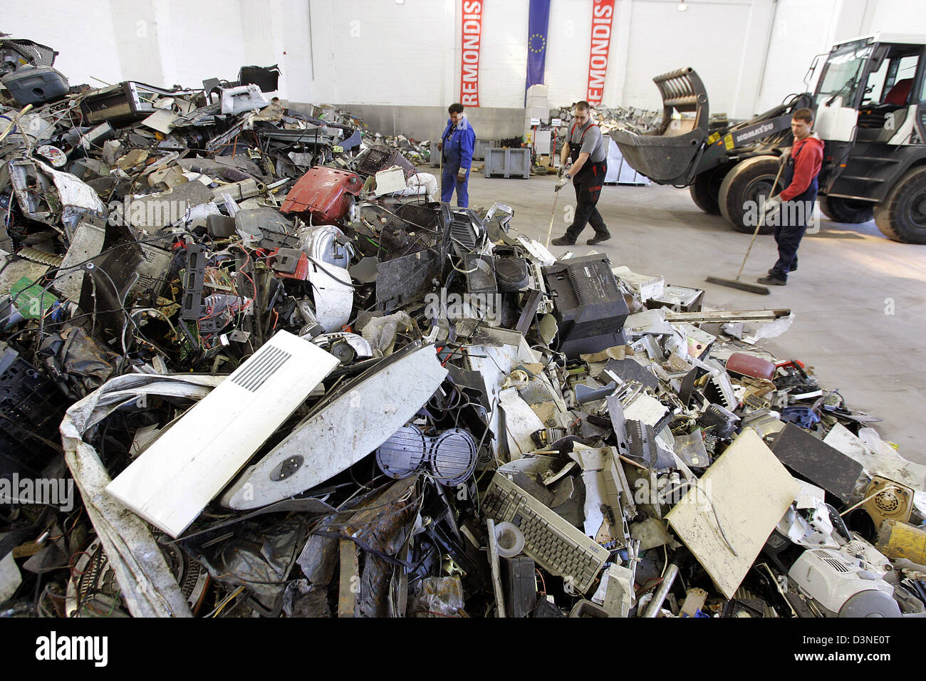 Electrical scrap is swept together in the processing centre for ...