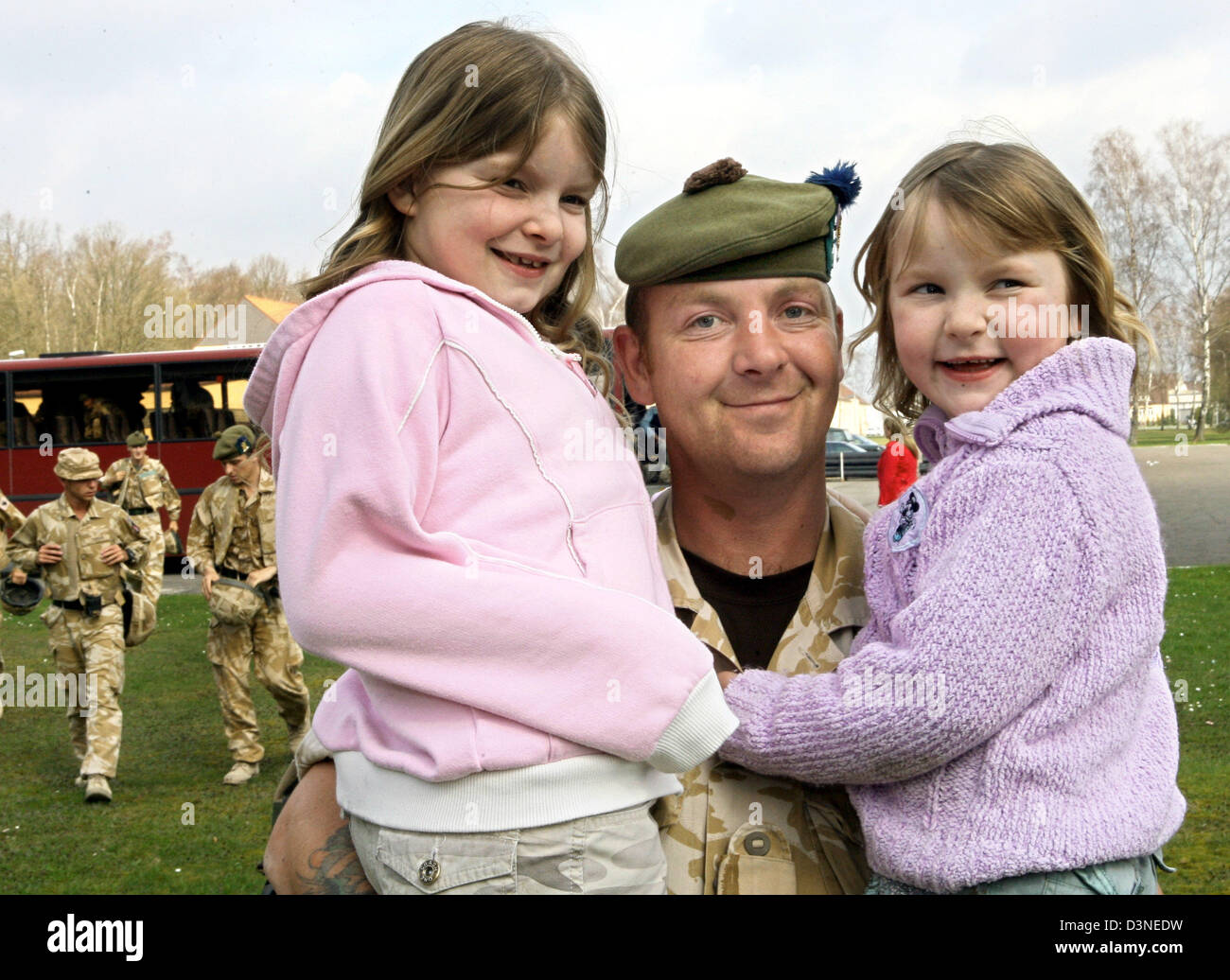 His daugthers Carla (L) and Nicole (R) happily welcome their father ...