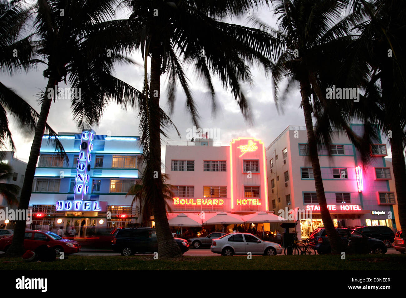 Neon lights light up the facades of hotels at dusk in the famous Art ...