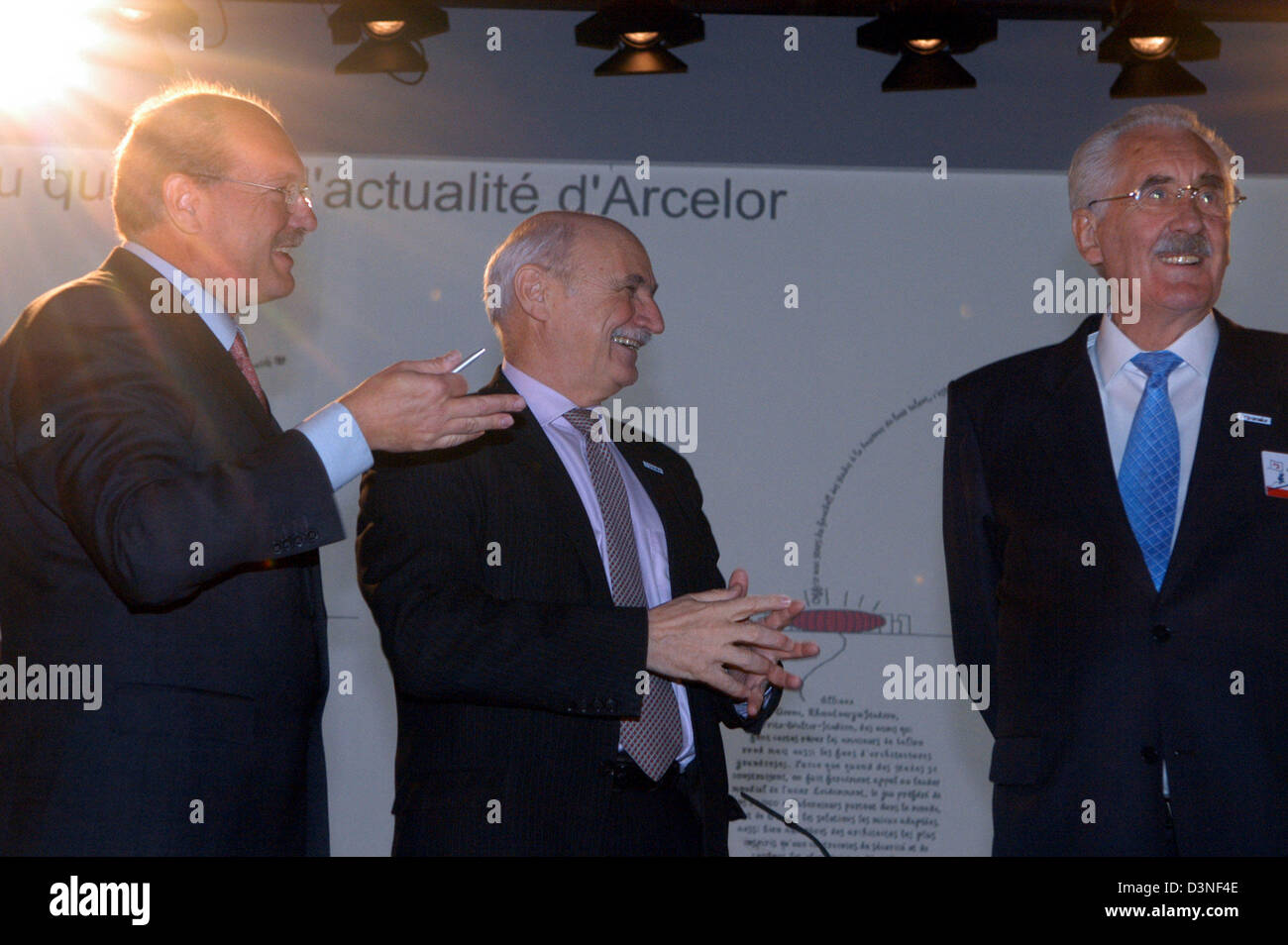 Guy Dolle (C), CEO of Arcelor, Senior Executive Vice-President Roland ...