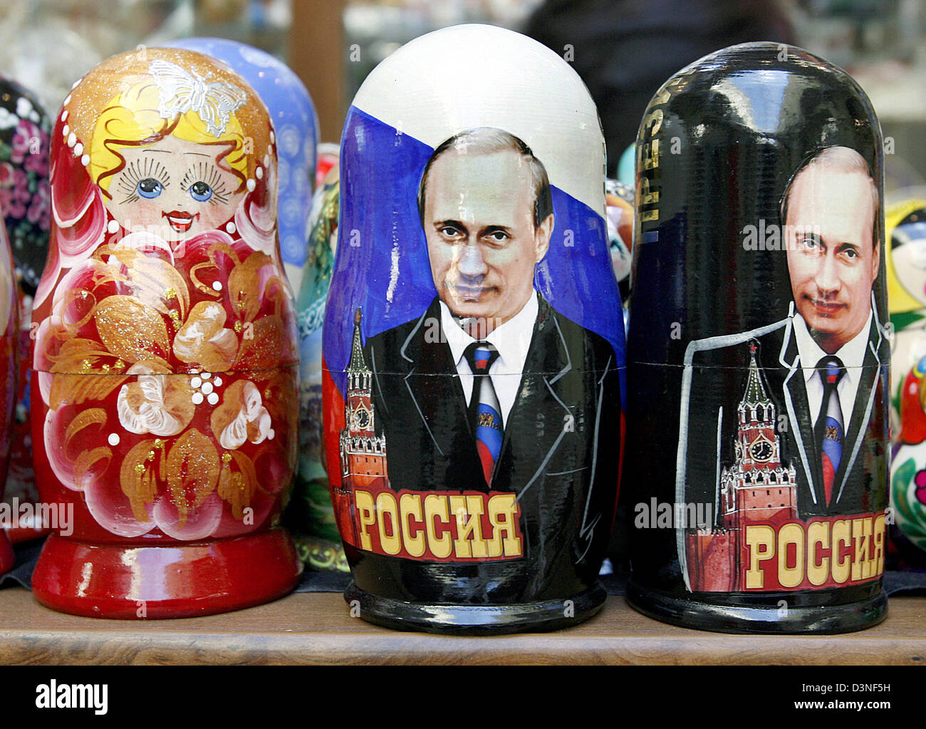 The picture shows colourful painted Matryoshkas with the portrait of ...