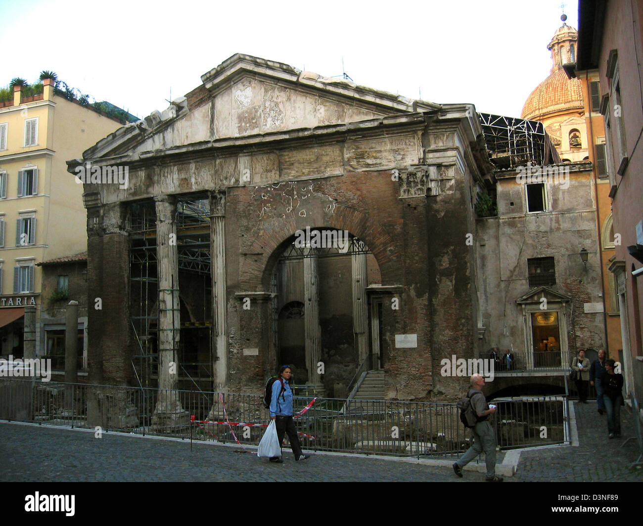 (FILE) - Tourists pass a derelict antique Roman building at the Piazza ...