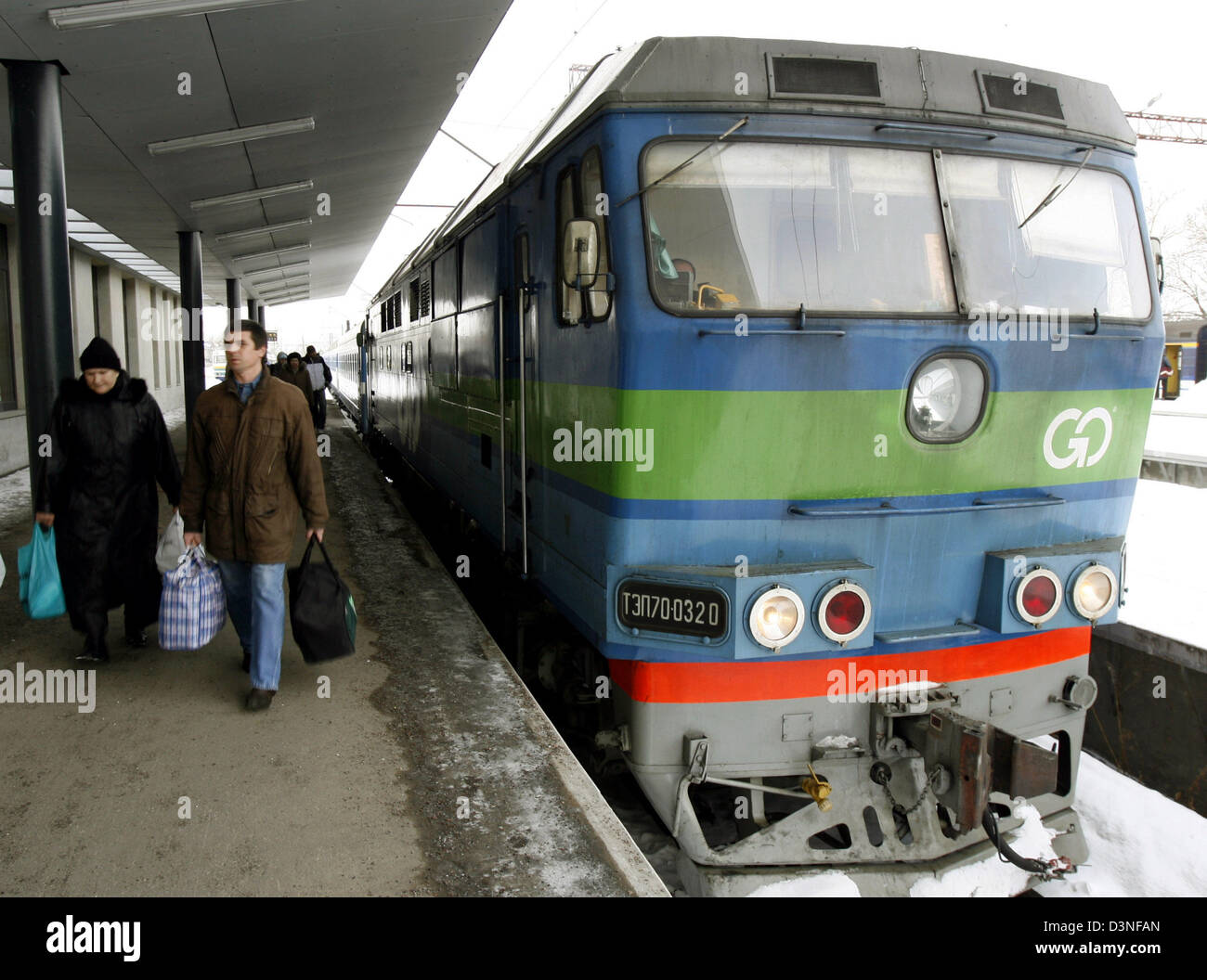 Passengers exit the night express from Moscow, Russia at the central ...