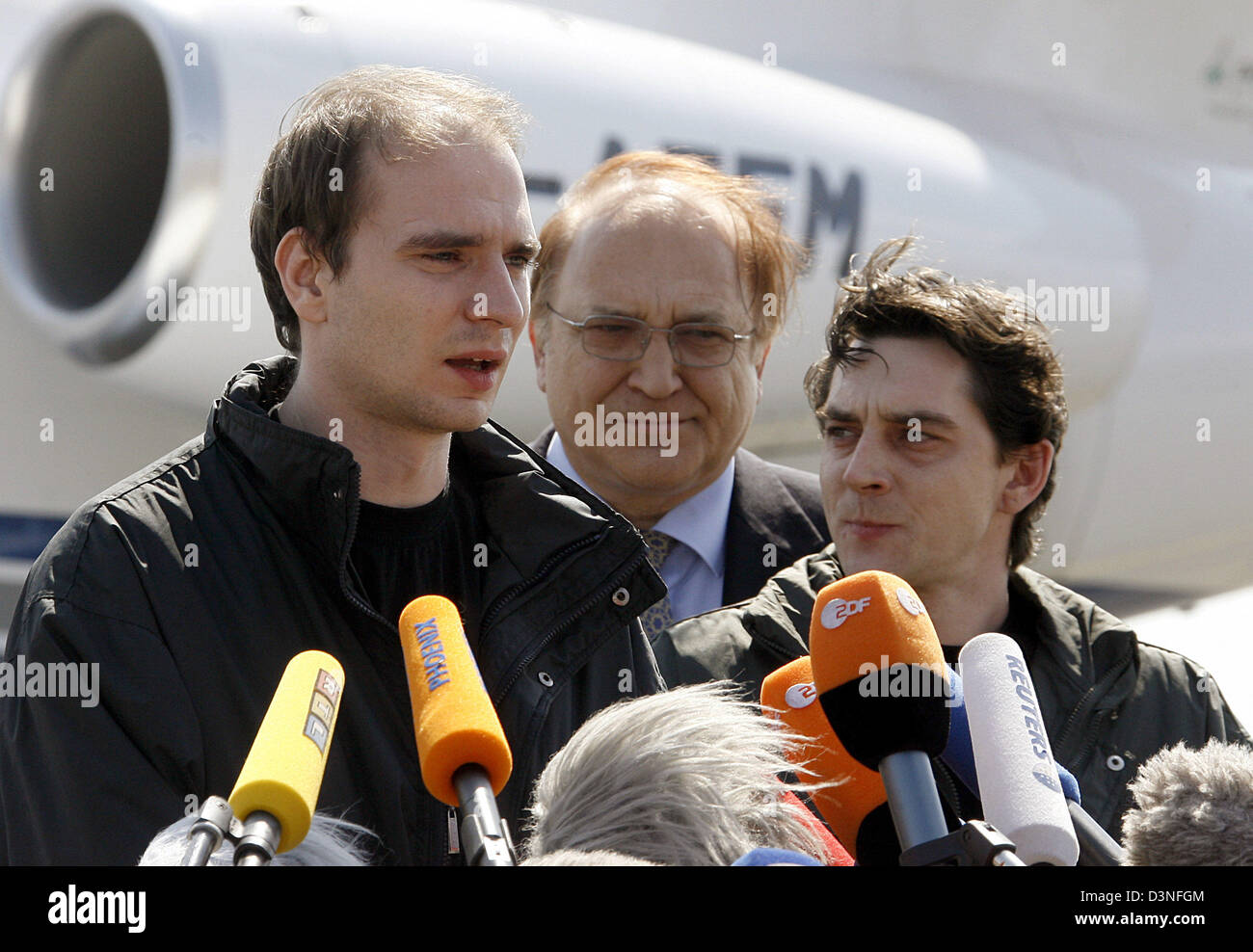German ambassador in Iraq Bernd Erbel stands in between Thomas ...