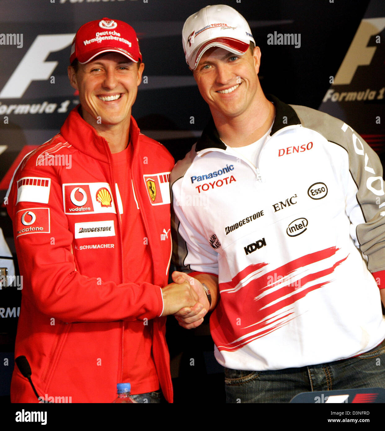 German Formula One pilot Michael Schumacher (L) of Scuderia Ferrari ...