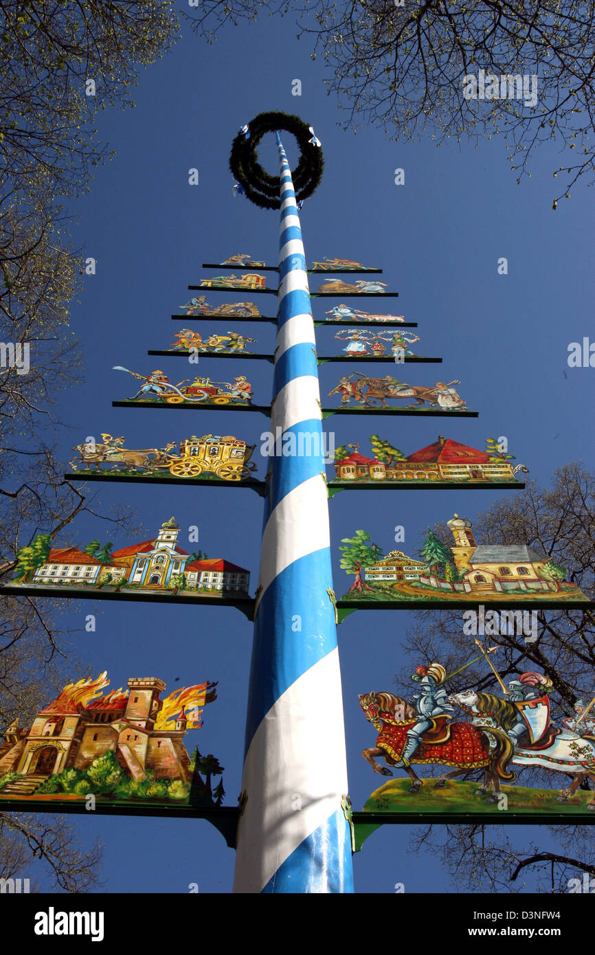 The picture shows a maypole with the traditional guild signs in ...