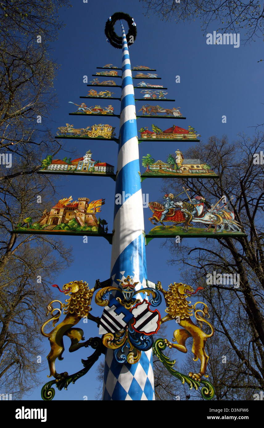 The picture shows a maypole with the traditional guild signs in ...