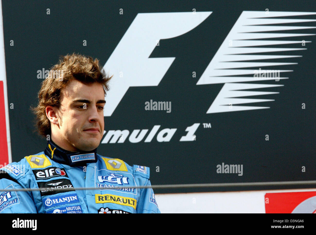 Spanish Formula One driver Fernando Alonso of Renault F1 team stands on ...