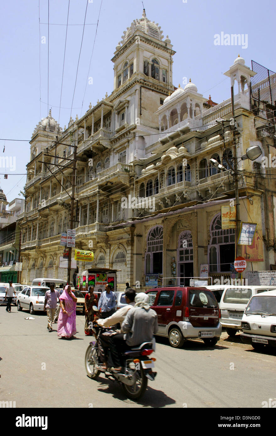 The photo shows a road with old colonial buildings in Indore, India, 28 ...