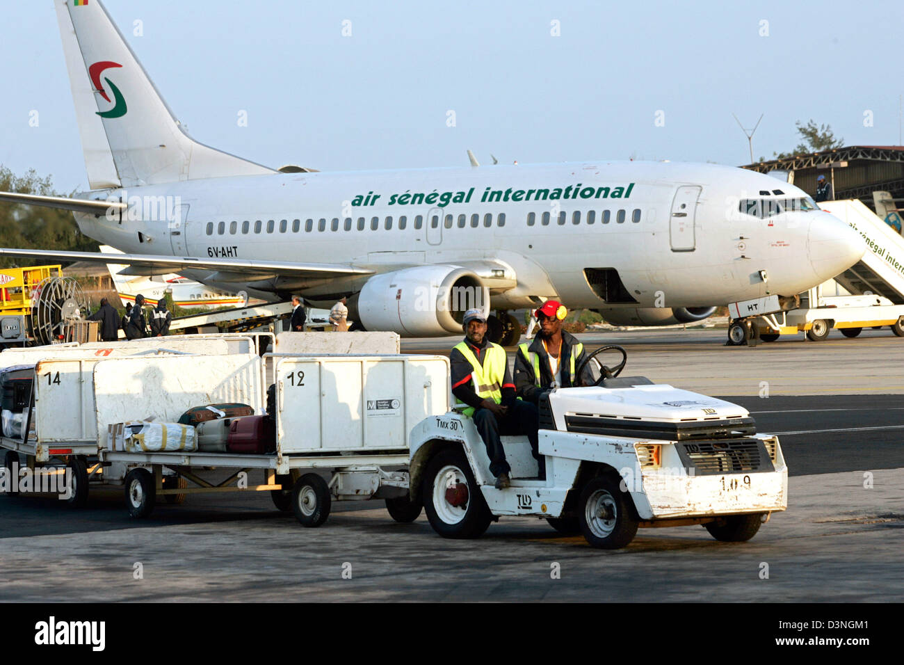 An aircraft of Air Senegal International is unloaded shortly after ...