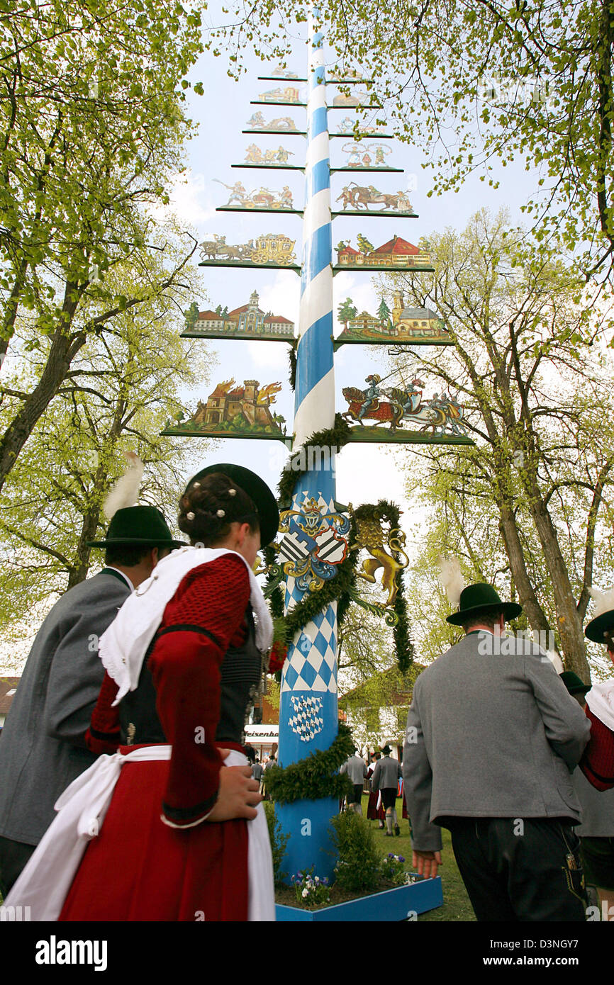 The picture shows the traditional dance around the maypole in ...