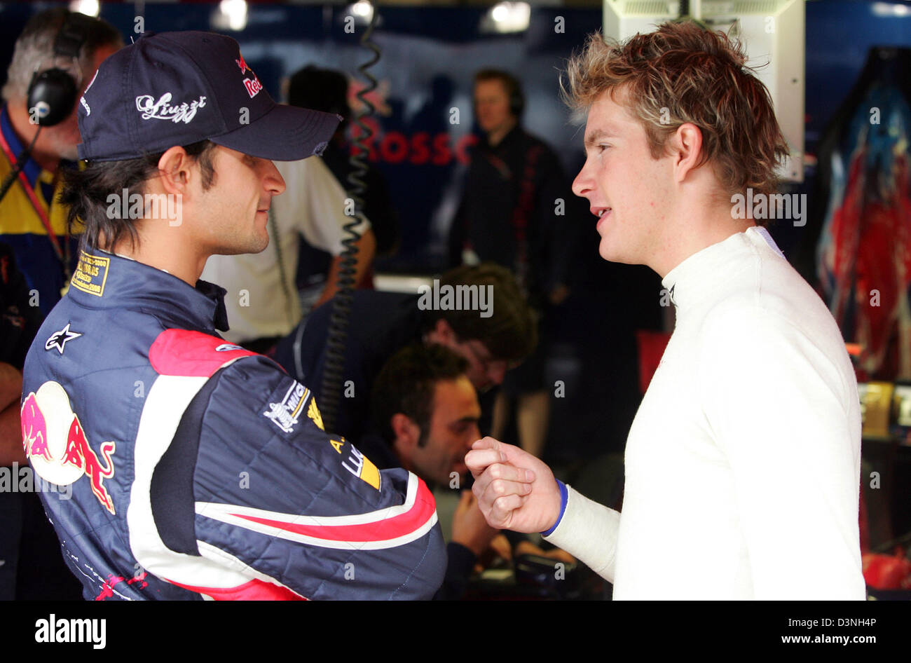 Italian Formula One pilot Vitantonio Liuzzi (L) and US Scott Speed (R ...