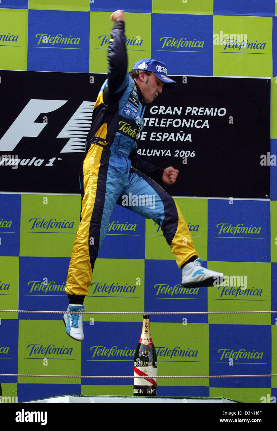 Spanish Formula One driver Fernando Alonso of the Renault F1 team jumps ...