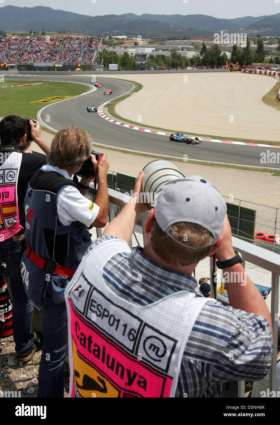 Photographers take pictures of Spanish Formula One driver Fernando ...