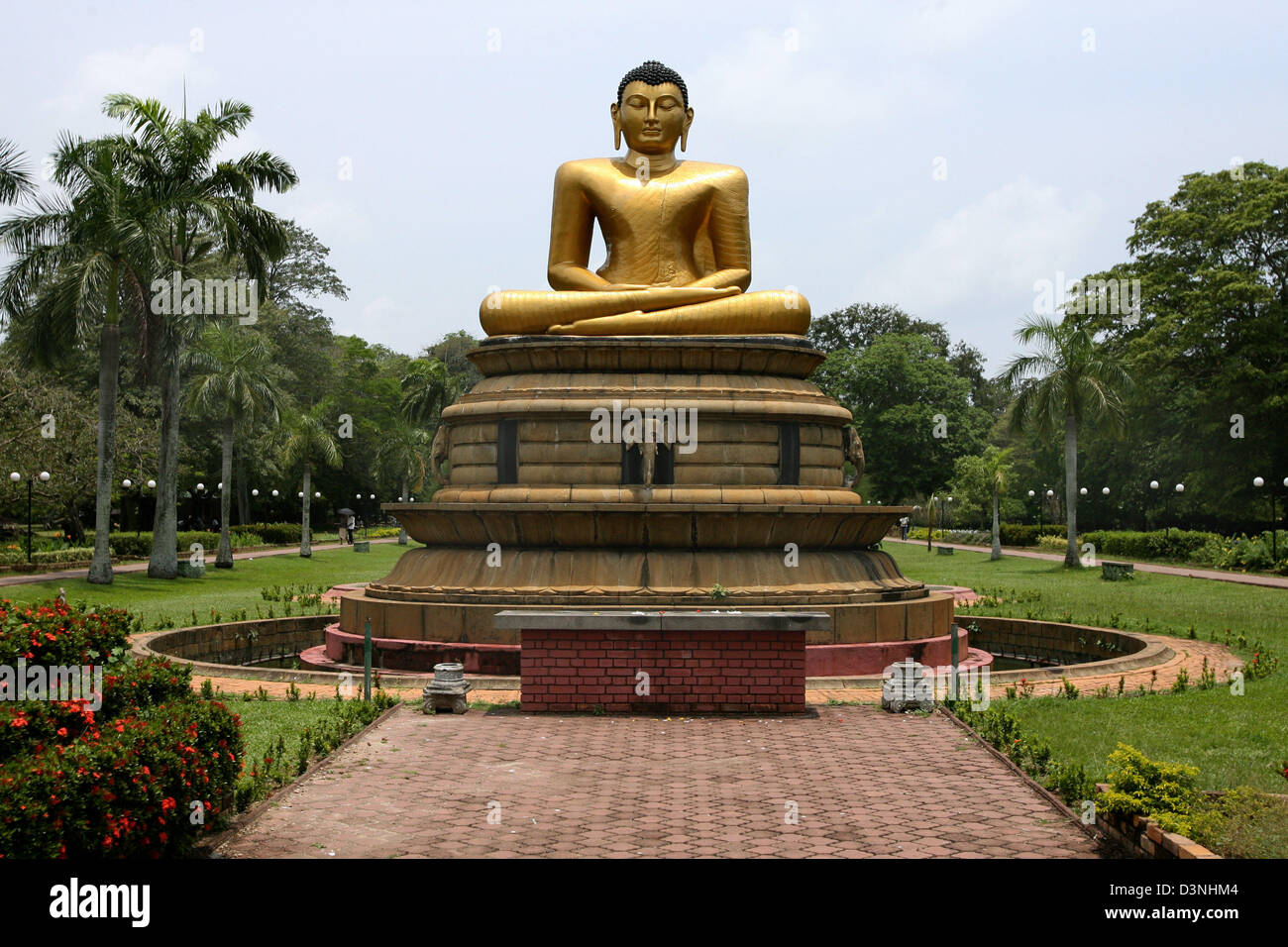 A golden Buddha statue pictured at the entrance to the Viharamahadevi ...