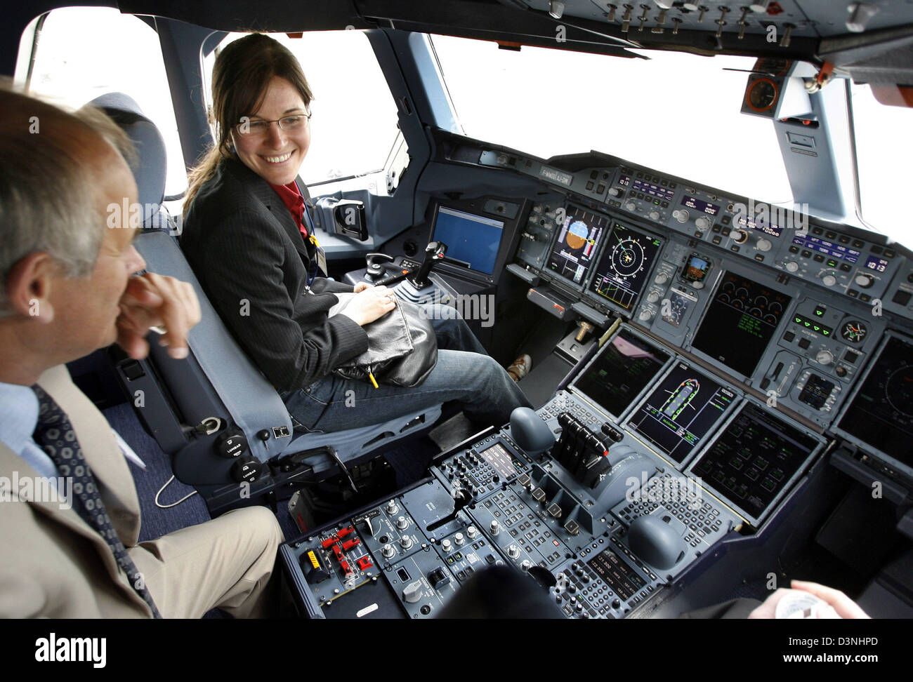 Airbus test pilot Peter Chandler (L) explains the cockpit of the new ...